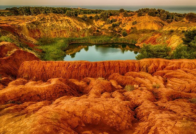 red soils around the lake in bauxite quarry near Otranto - Vivida Photo PC